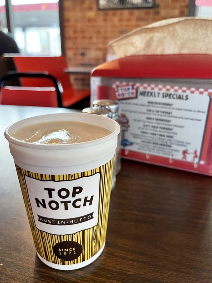 That branded milkshake cup sitting on the table is practically begging you to take a thick, creamy sip right now.