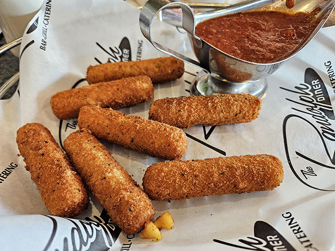 Mozzarella sticks with marinara that would make an Italian grandmother nod in approval. Crispy outside, molten cheese pull inside.