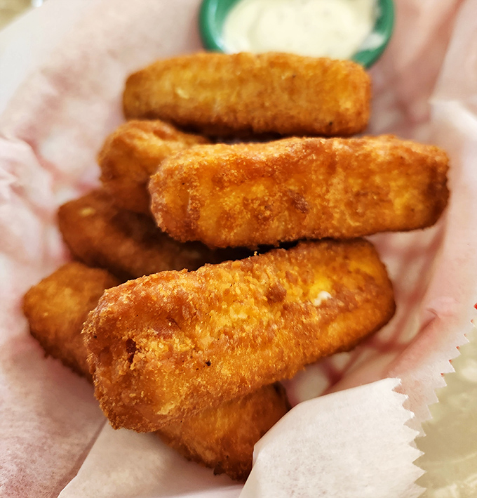These golden mozzarella sticks aren't just appetizers &ndash; they're crispy vessels delivering molten cheese straight to your happiness receptors.