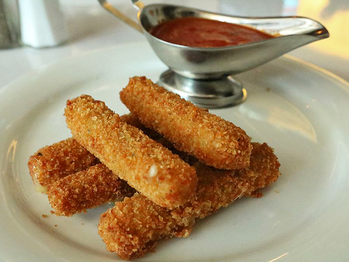 Mozzarella sticks: the diplomat of appetizers. Crispy golden exterior, molten cheese interior, and marinara for dipping&mdash;bringing peace to tables since diners began.