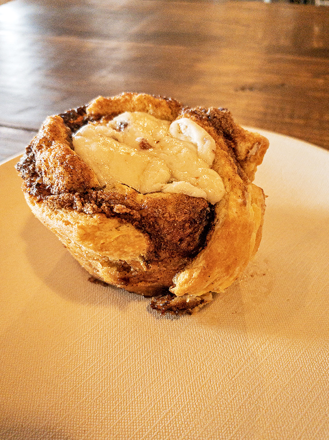 This cinnamon roll isn't just baked, it's been loved &ndash; crispy edges giving way to a gooey center that's basically breakfast's answer to a warm hug.