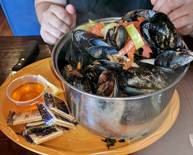 These mussels aren't just flexing &ndash; they're swimming in a fragrant broth that demands to be sopped up with every available piece of bread.