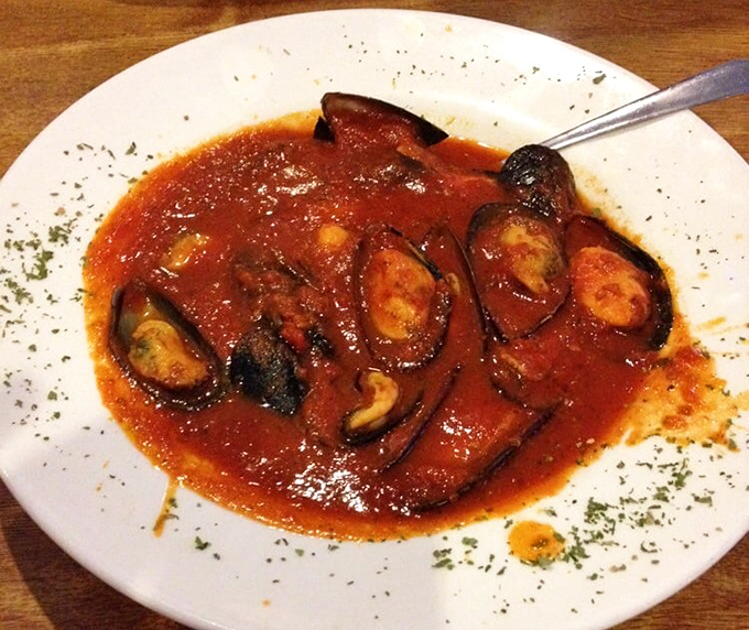 The mussels marinara arrive swimming in a tomato bath so good you'll want to request extra bread for necessary sauce-sopping duties.