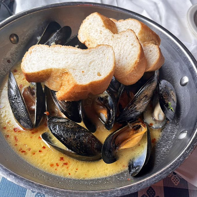 Mussels swimming in garlic butter with crusty bread for dipping&mdash;this is how coastal living is supposed to taste.