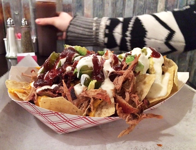 These nachos aren't just loaded&mdash;they're having an existential crisis under the weight of all that pulled pork, sauce, and jalape&ntilde;os. Worth every messy bite.