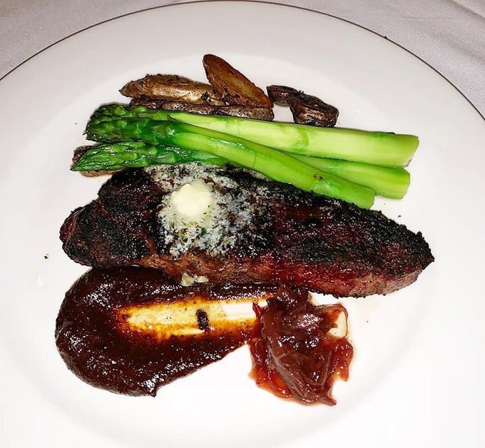 The New York Strip arrives like a rockstar on a plate &ndash; commanding attention with its perfect char, accompanied by asparagus standing at attention like loyal fans.