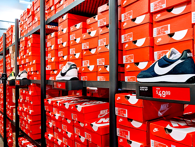 The wall of Nike boxes resembles the world's most organized sneakerhead's dream closet. That $49.99 tag is the real MVP.