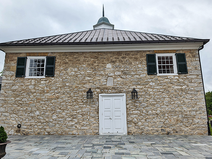 This sturdy stone church stands as a testament to early American craftsmanship, its weathered walls holding stories of generations past.
