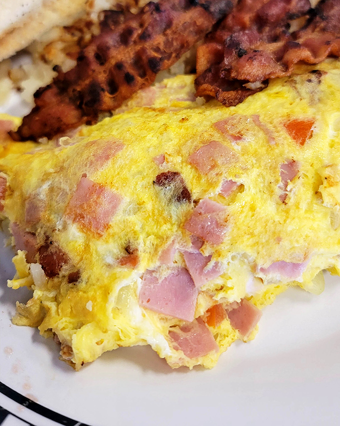 This isn't just an omelet&mdash;it's a masterpiece of ham and cheese architecture that makes you question why you ever eat anything else.