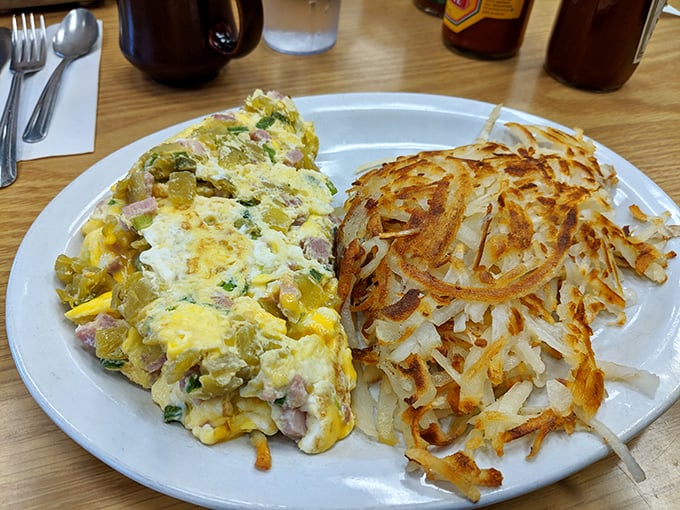 This isn't just an omelet&mdash;it's a perfectly executed egg envelope delivering ham, cheese, and veggies with the precision of a Swiss watch. 