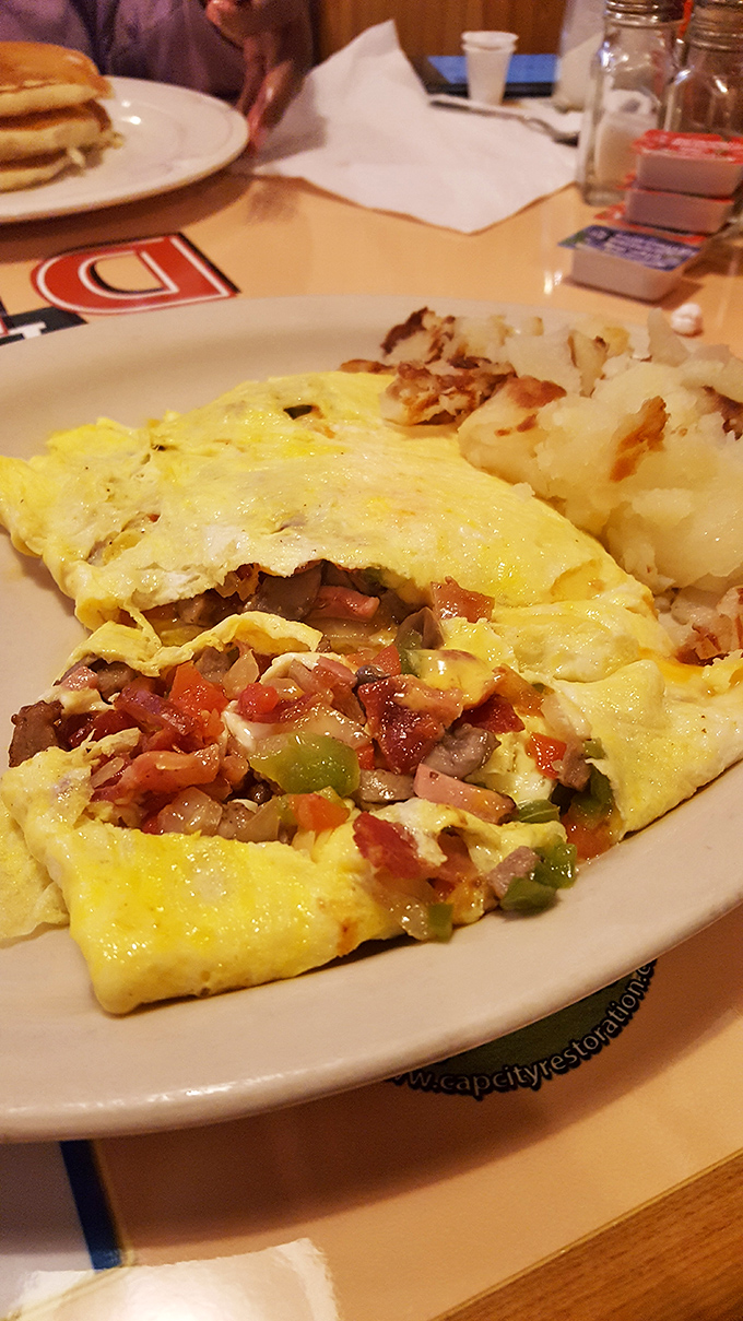 Fluffy omelet perfection folded around fresh ingredients that would make your favorite brunch spot weep with envy.