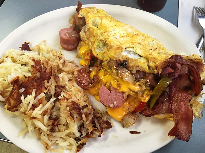 This isn't just an omelet&mdash;it's a treasure chest of breakfast jewels with perfectly crisped hash browns standing guard on the side.