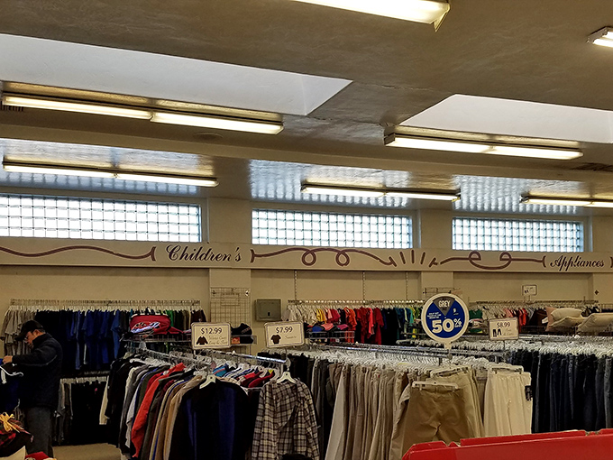 The children's section neighbors appliances in a retail layout that makes as much sense as life itself&mdash;chaotic but somehow functional.