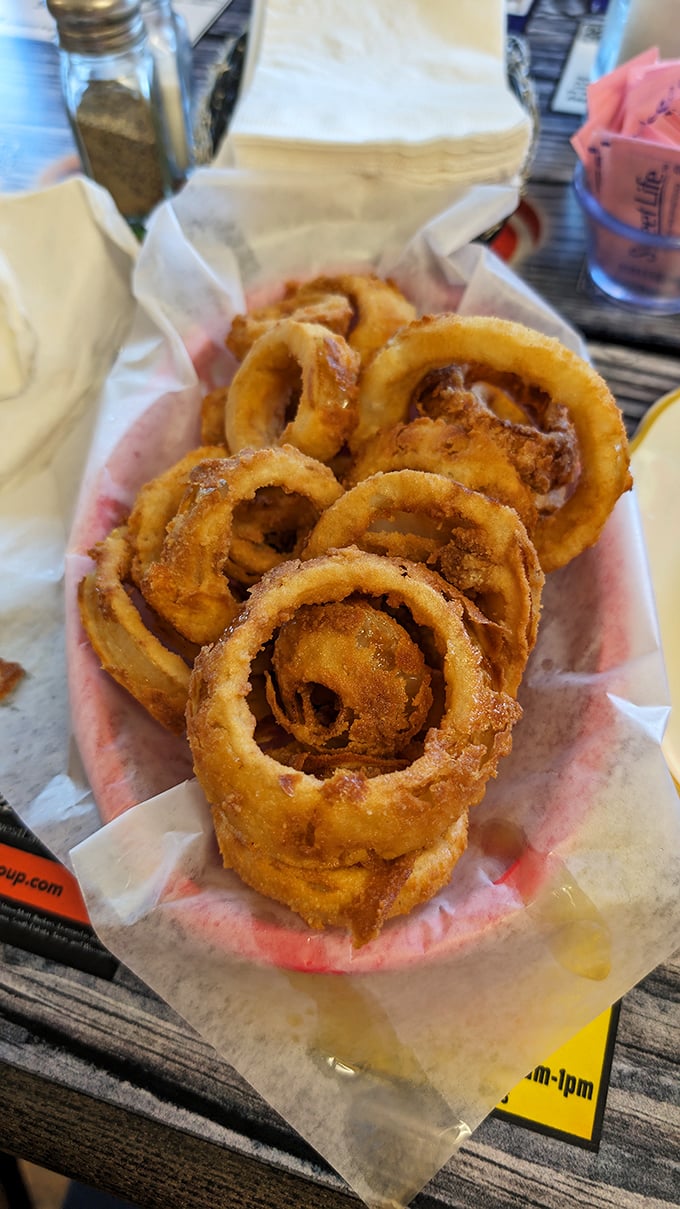 These aren't just onion rings; they're golden halos of happiness. Crispy, sweet, and utterly impossible to share.