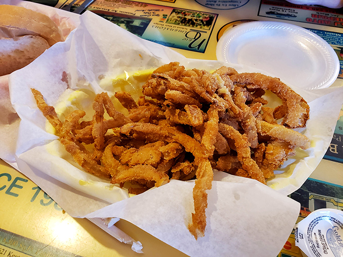 These aren't just onion rings; they're crispy golden halos that make you wonder why anyone bothers with those frozen imposters from the grocery store.