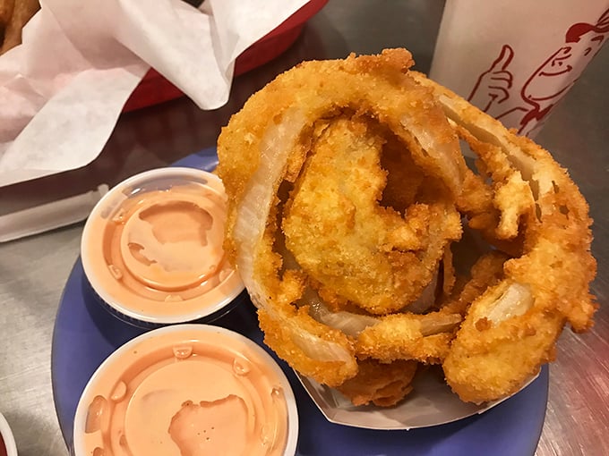 Golden halos of crispy perfection. These onion rings deserve their own fan club, complete with membership cards and secret handshakes.