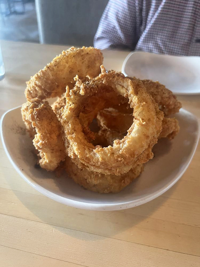 Onion rings with architectural integrity that would make Frank Lloyd Wright proud. Crispy, golden halos of happiness.