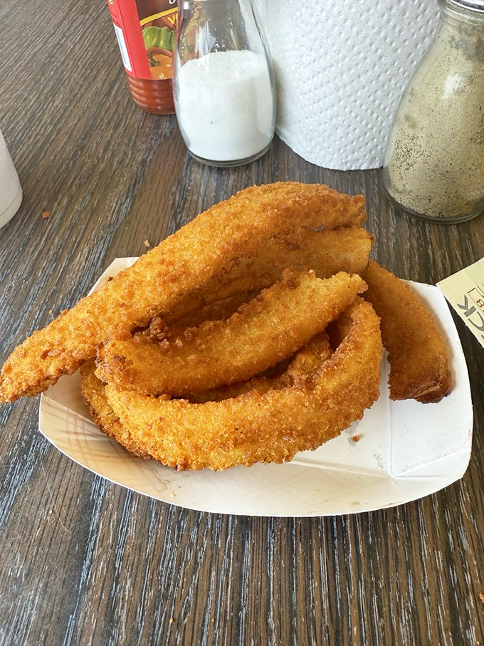 Golden-brown onion rings with that perfect crunch&mdash;the supporting actors that sometimes steal the show from the headlining hot dogs.