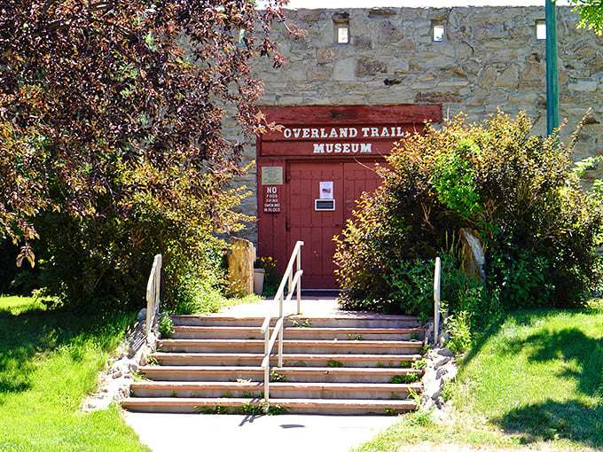 The Overland Trail Museum's rustic entrance promises stories more fascinating than anything you'll find scrolling through your phone for the next hour.
