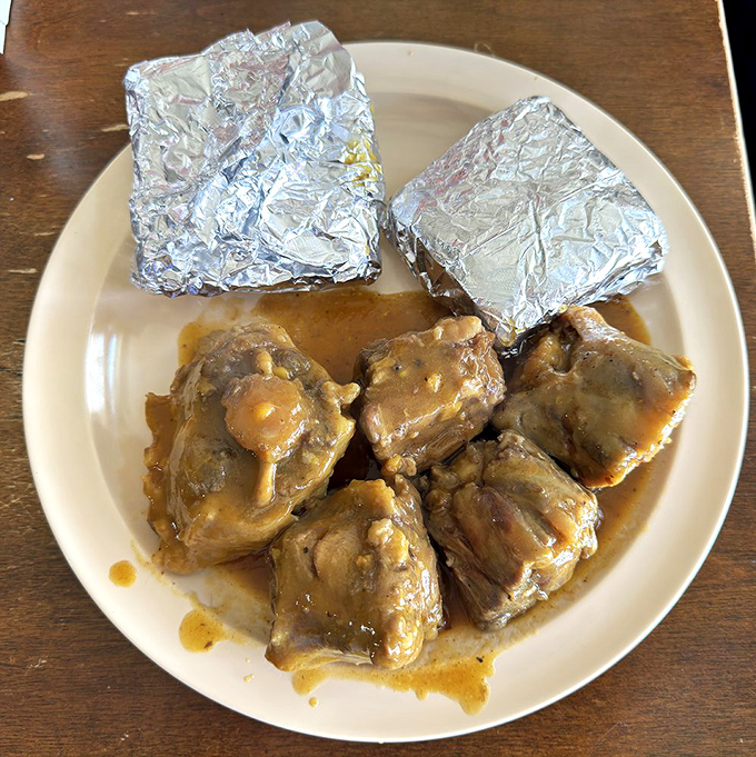 These oxtails aren't just fall-off-the-bone tender; they've practically filed divorce papers from the bone and moved out on their own.