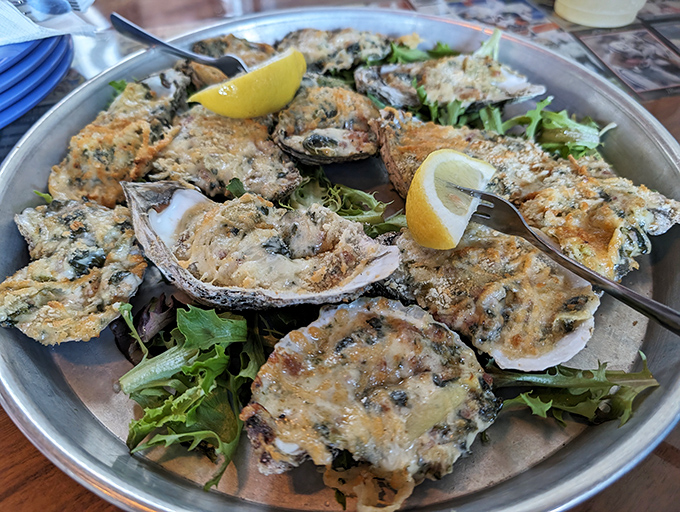 Oysters Rockefeller that would make the Vanderbilts jealous. These briny beauties are transformed into creamy, herb-topped treasures served on a bed of fresh greens.