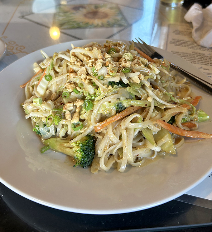 Pad Thai done right means every noodle gets its moment to shine, topped with crushed peanuts like edible confetti.