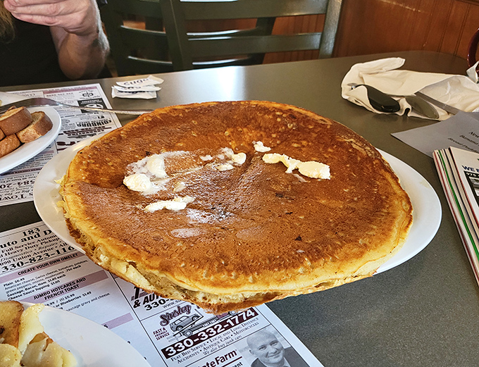 Pancakes shouldn't wear jewelry, but if they did, this golden-brown beauty with melting butter would be dressed for the red carpet.