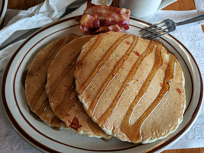 Pancakes so perfectly golden they make you wonder if the griddle is actually made from the hopes and dreams of breakfast enthusiasts.