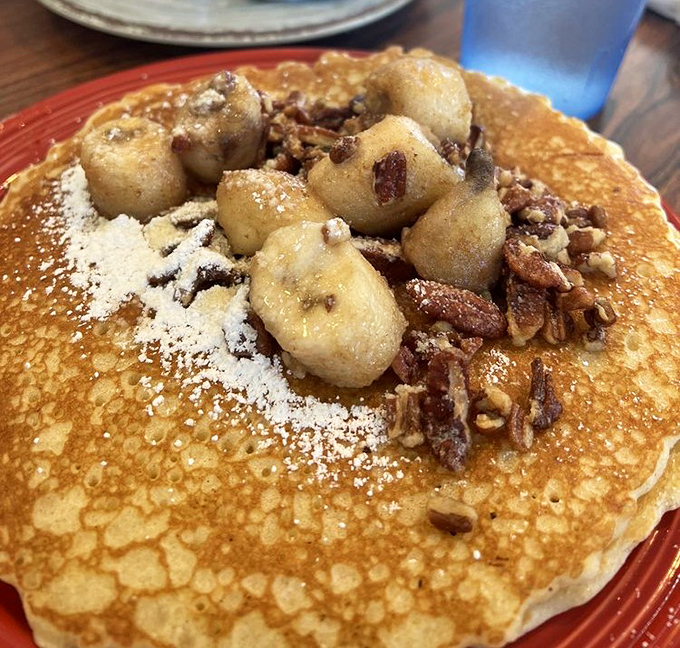 This isn't just a pancake&mdash;it's a throne for caramelized bananas and pecans, dusted with powdered sugar. Breakfast royalty at its finest.