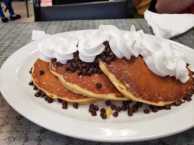 Chocolate chip pancakes with whipped cream &ndash; because sometimes breakfast should feel like you're getting away with something deliciously naughty.