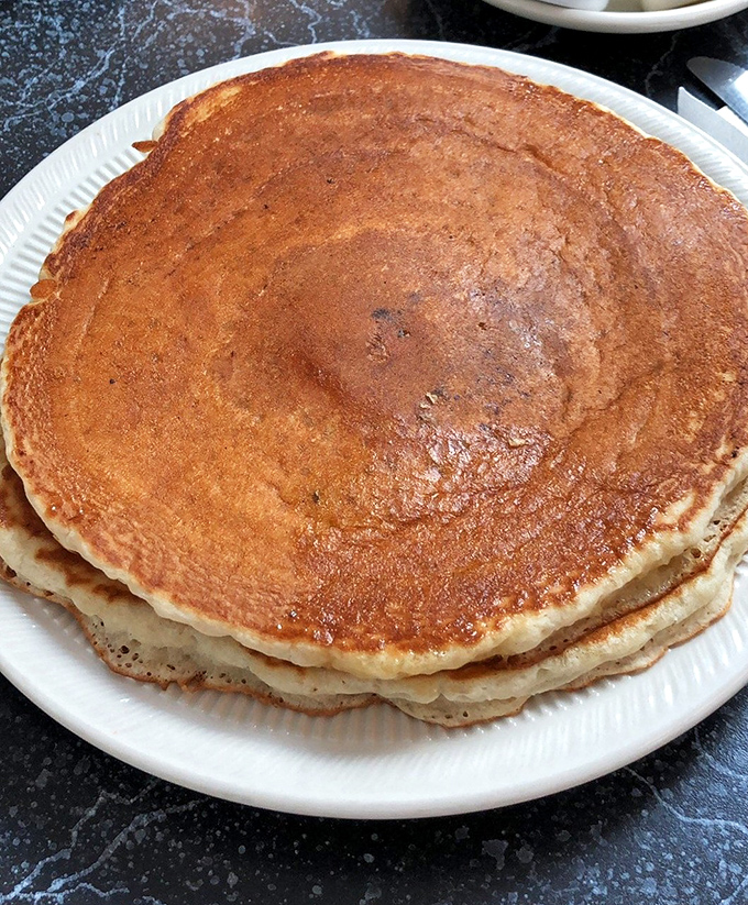 These pancakes aren't just breakfast; they're edible frisbees of joy, perfectly golden and ready to soak up rivers of maple syrup.