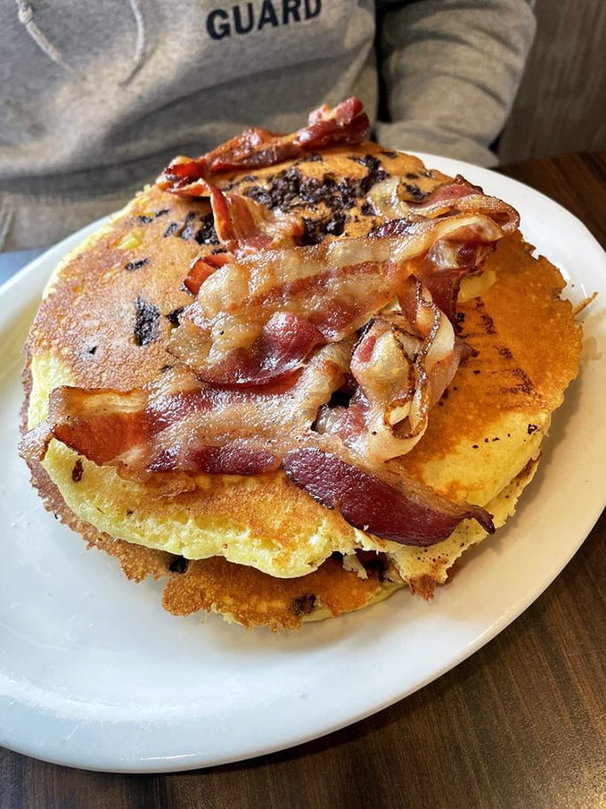 Pancakes with bacon that aren't just a meal but a spiritual experience. The maple syrup river makes everything right with the world.