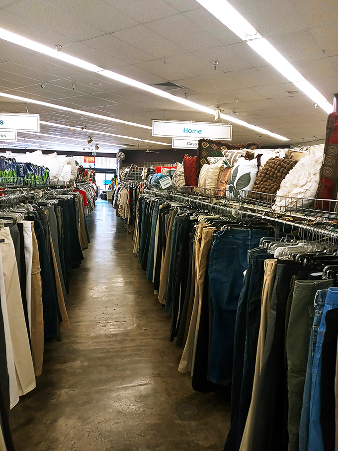 The pants section stretches toward infinity, a denim rainbow organized with military precision. Your perfect pair awaits somewhere in this textile galaxy.