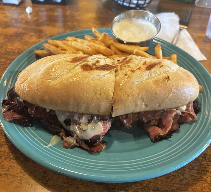 This pastrami sandwich isn't messing around. Packed with meat and melty cheese, it's the kind of sandwich that demands both hands and zero distractions.