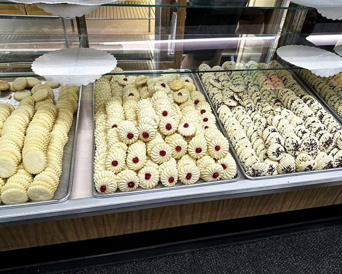 Cookie paradise! Thumbprints with ruby centers sit alongside chocolate-drizzled beauties like sweet soldiers awaiting their marching orders.