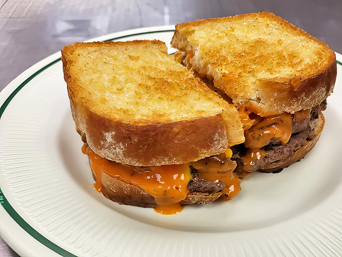 Melted cheese cascading down perfectly grilled beef on toasted bread. This patty melt isn't just a sandwich—it's a warm hug on a plate.