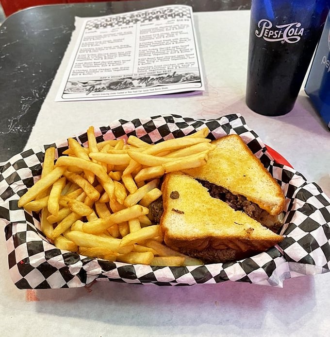 The patty melt and fries arrive in their checkered paper boat, ready to sail directly into your happy place.
