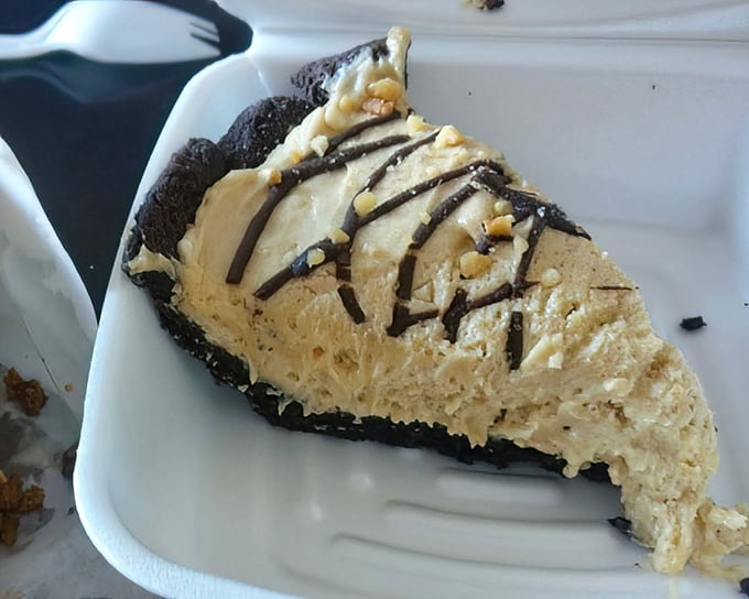 Peanut butter pie with an Oreo crust and chocolate drizzle: because sometimes dessert needs to make a statement, not whisper.