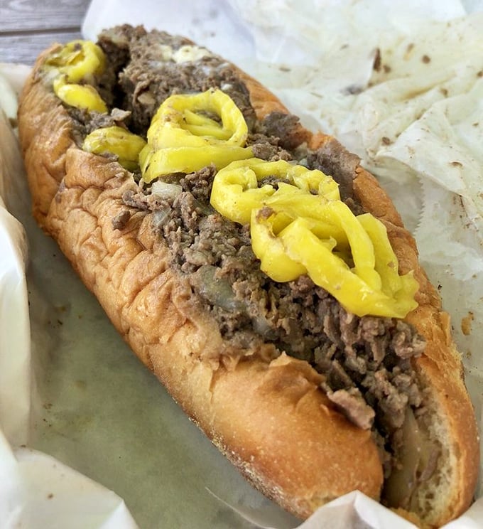 Those banana peppers aren't just a topping—they're jewelry for your cheesesteak. The perfect acid kick to cut through all that meaty goodness.
