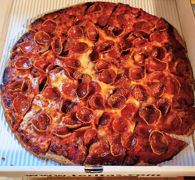 Pepperoni that curls into perfect little flavor cups, creating tiny pools of savory goodness. This is pizza engineering at its finest.