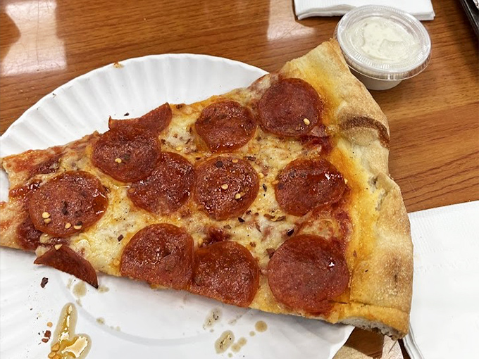 Pizza perfection in pepperoni form. Those crispy-edged discs of spicy goodness are like little flavor islands on a sea of melted cheese.