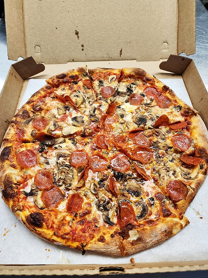 Pizza perfection doesn't need fancy toppings&mdash;just the classics done right, with cheese that stretches like it's auditioning for the Olympics.