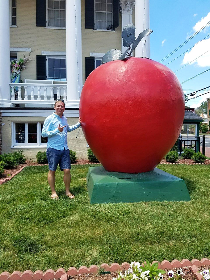 The universal "I'm-holding-up-this-giant-thing" pose never gets old, especially when it's a massive apple in Virginia's apple country.