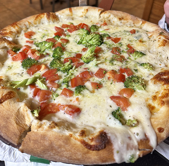 Who needs a round table when you've got a round pizza? This broccoli and tomato pie proves knights in shining armor come in cheesy form too.