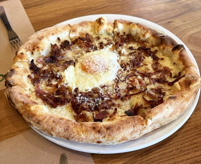 Wood-fired perfection with a blistered crust that crackles like vinyl records. This pizza isn't just food&mdash;it's edible architecture.