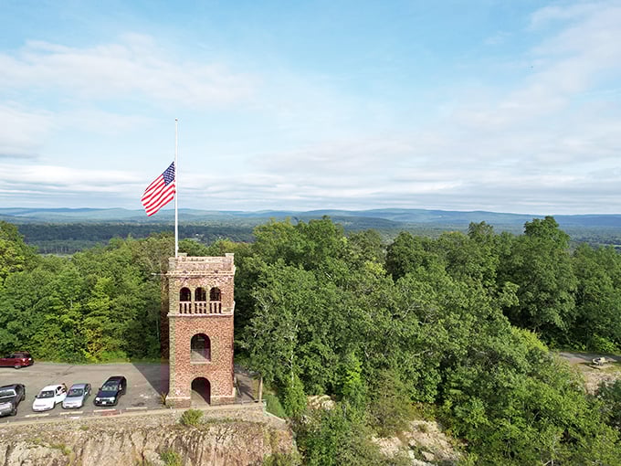 Poet's Seat Tower stands like a medieval castle lookout, offering views that would make even the most jaded New Englander pause mid-complaint about winter.