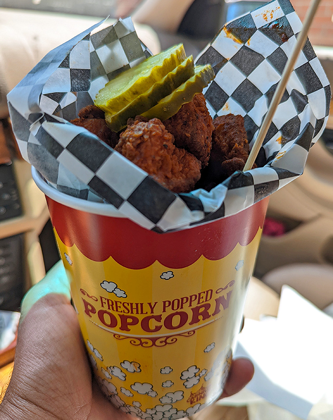 Popcorn chicken that puts movie theater popcorn to shame. These bite-sized flavor bombs come with pickle slices that cut through the heat like culinary superheroes.