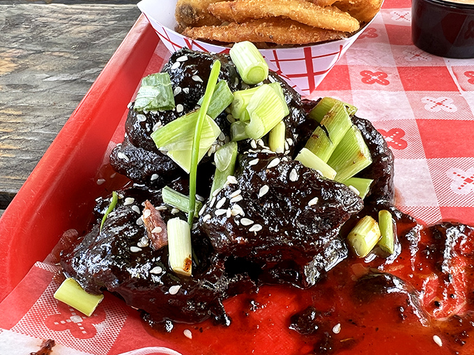 These glistening pork belly burnt ends, lacquered with sauce and topped with scallions, are what barbecue dreams are made of.