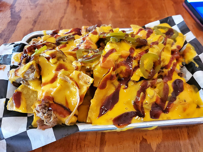 BBQ nachos that laugh in the face of subtlety. A glorious mess of cheese, jalape&ntilde;os, and smoky meat that demands to be shared.