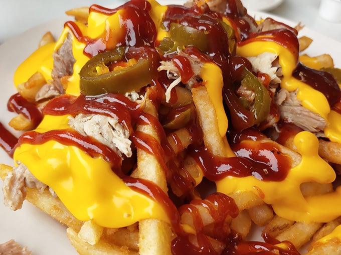 Loaded fries that don't know the meaning of restraint&mdash;cheese sauce and pulled pork engaged in a delicious tug-of-war for your taste buds' attention.